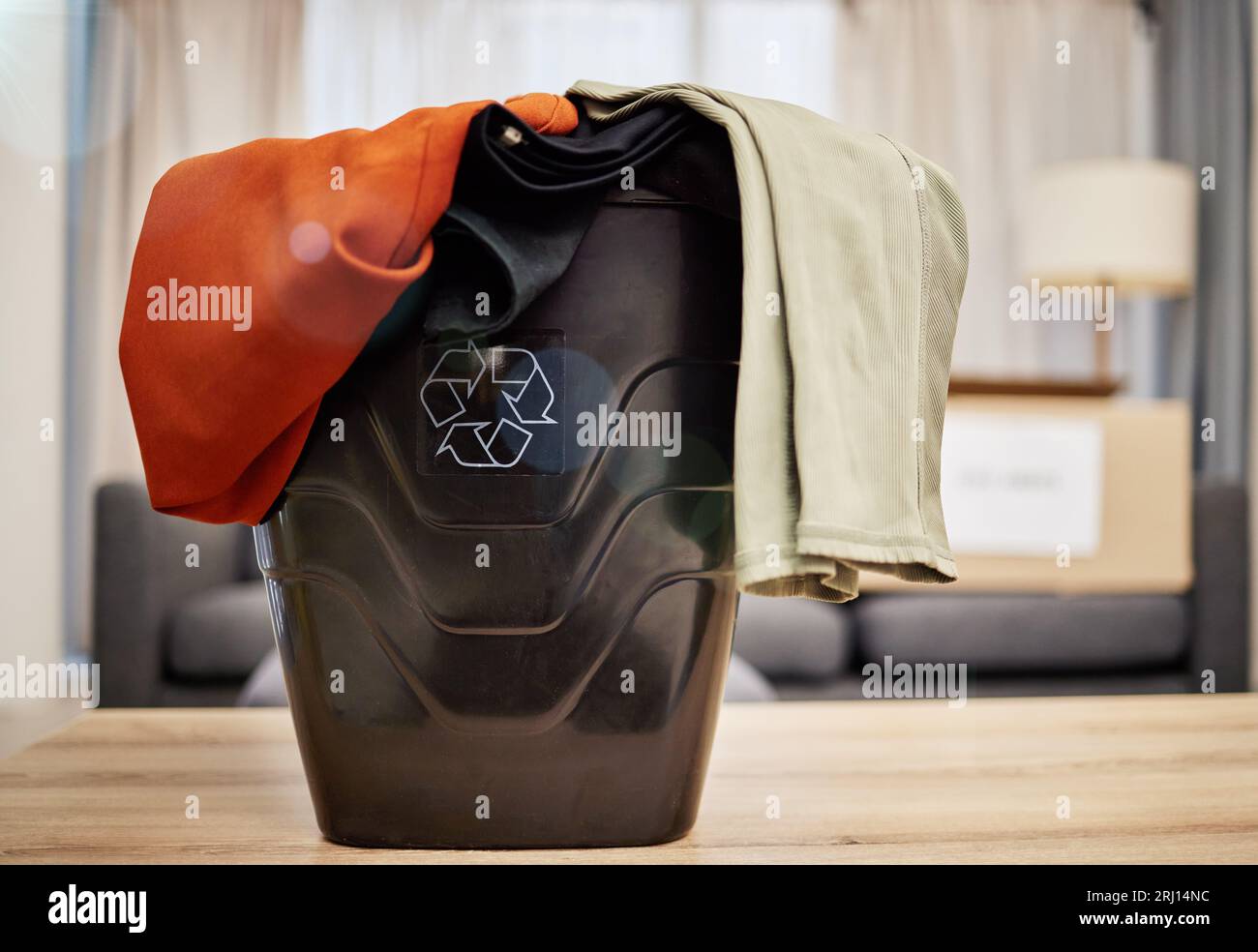 Sustainability, recycle and clothes in basket for charity, donation and ...