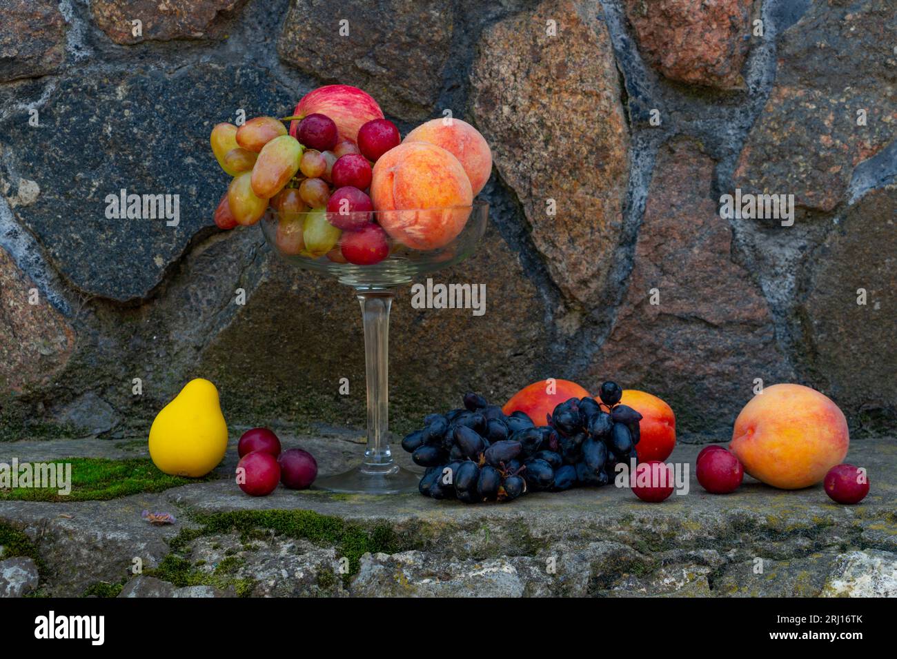 Still life of fruits, rich harvest, peaches and grapes Stock Photo - Alamy