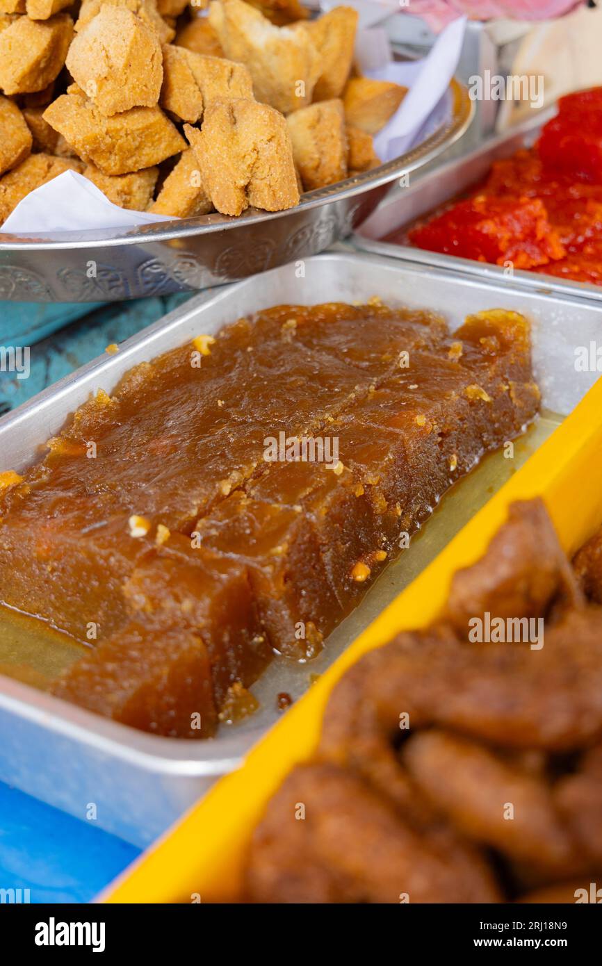 Delicious street food in a market setting in Asia Stock Photo - Alamy