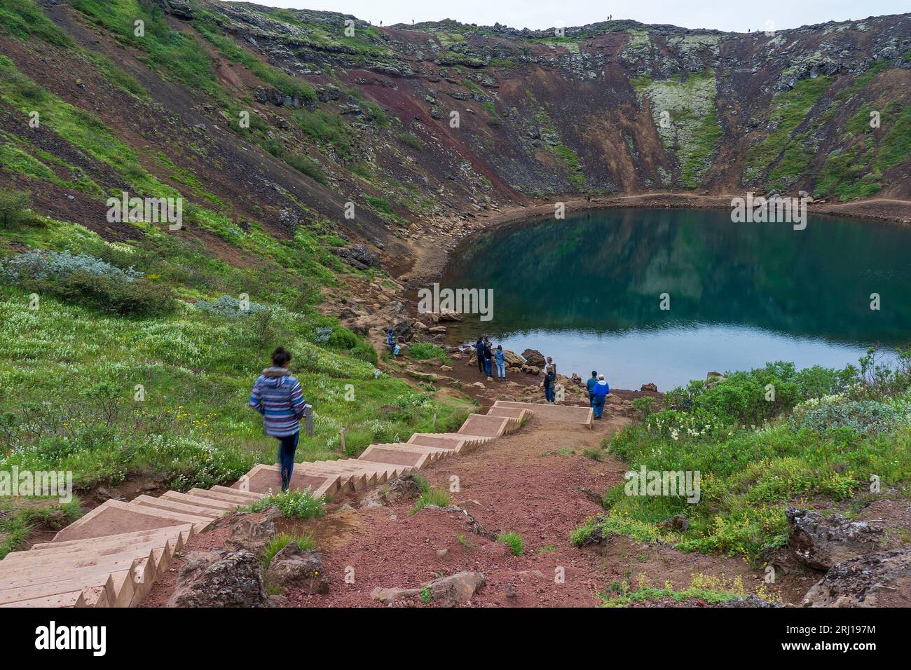 People exploring Kerid, volcanic crate lake in ,Grimsnes , Iceland ...