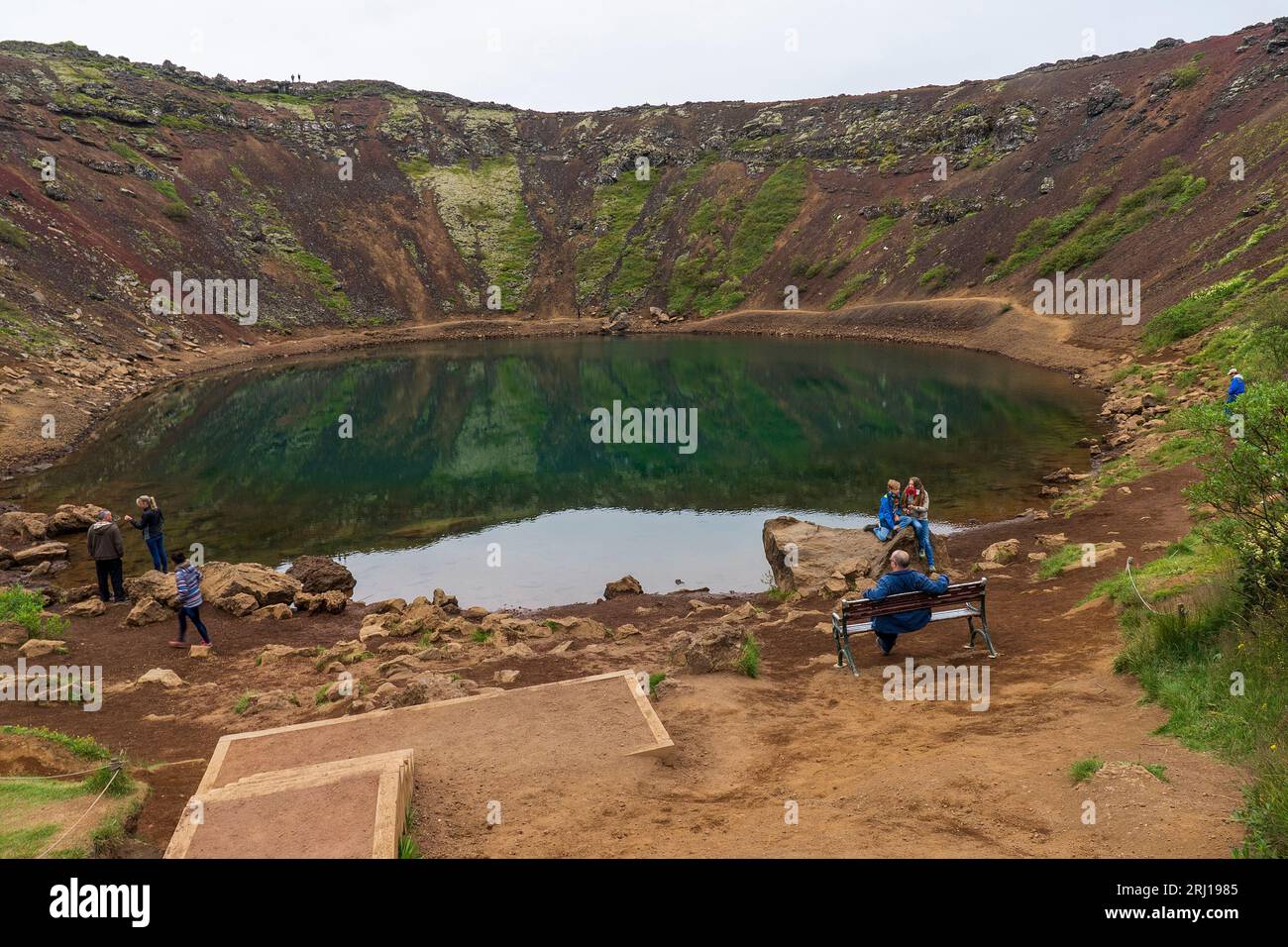 People exploring Kerid, volcanic crate lake in ,Grimsnes , Iceland ...