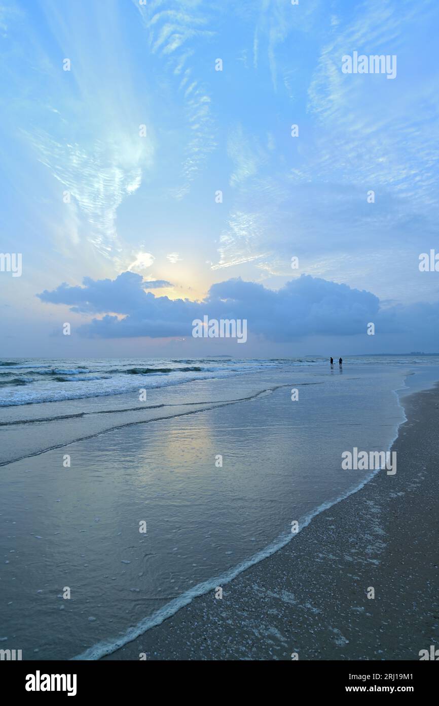 South Goa | Tiny waves on the beach under dusky clouds Stock Photo - Alamy