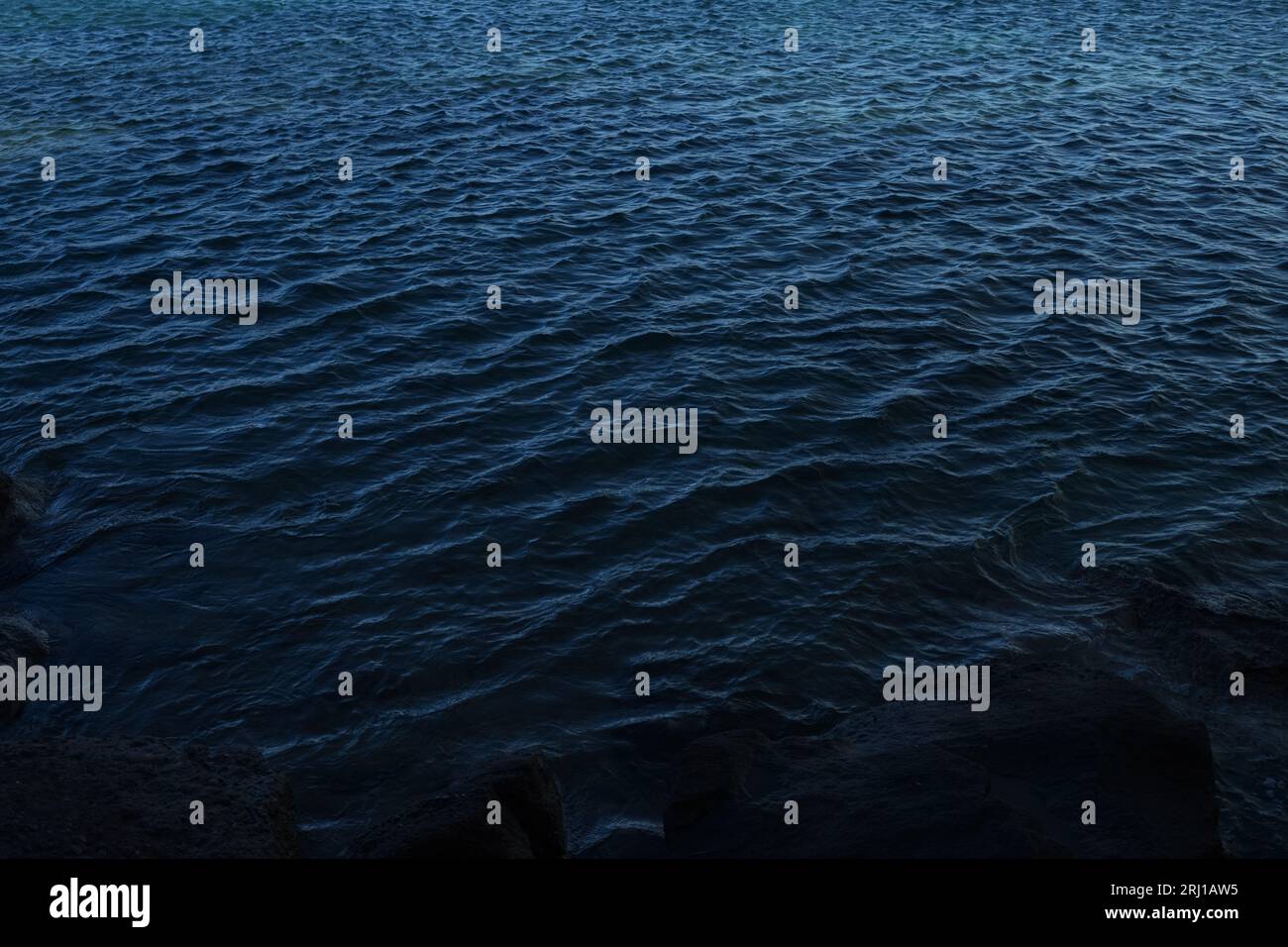 Closeup photo of mediterranean sea water in a shade, shallow focus ...