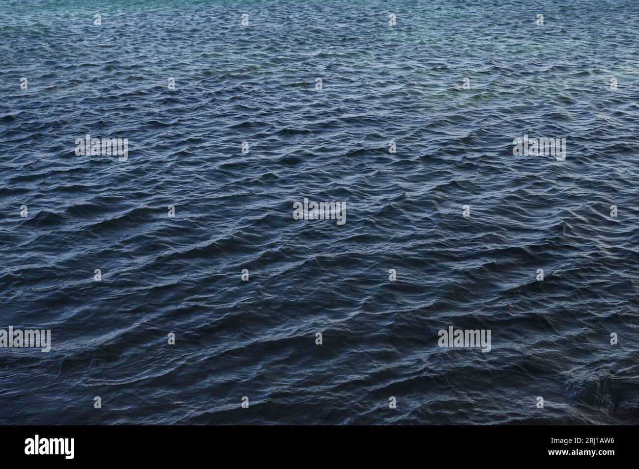 Closeup photo of mediterranean sea water in a shade, shallow focus ...