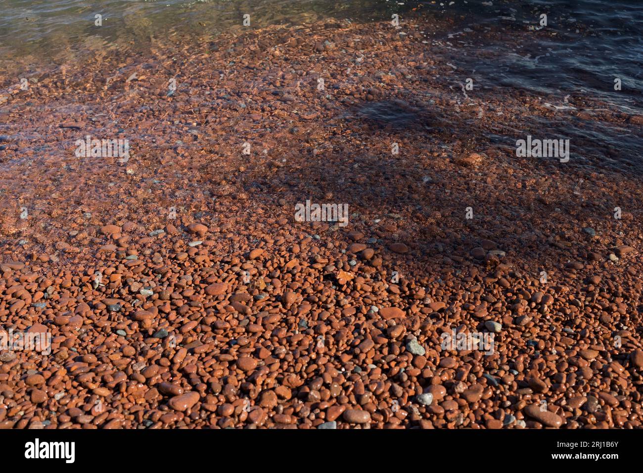French Riviera beach with red pebbles, travel content Stock Photo - Alamy