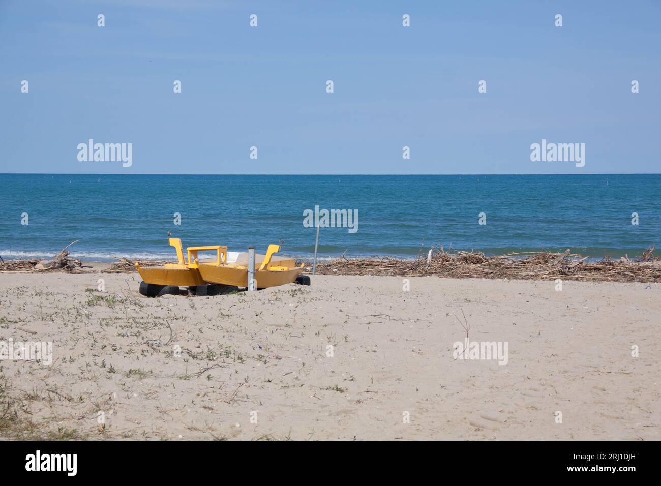 Boat laying on the beach during daytime Stock Photo - Alamy