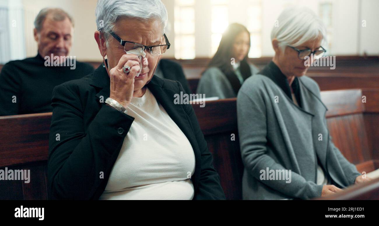 Sad, funeral or old woman crying in church for God, holy spirit or ...