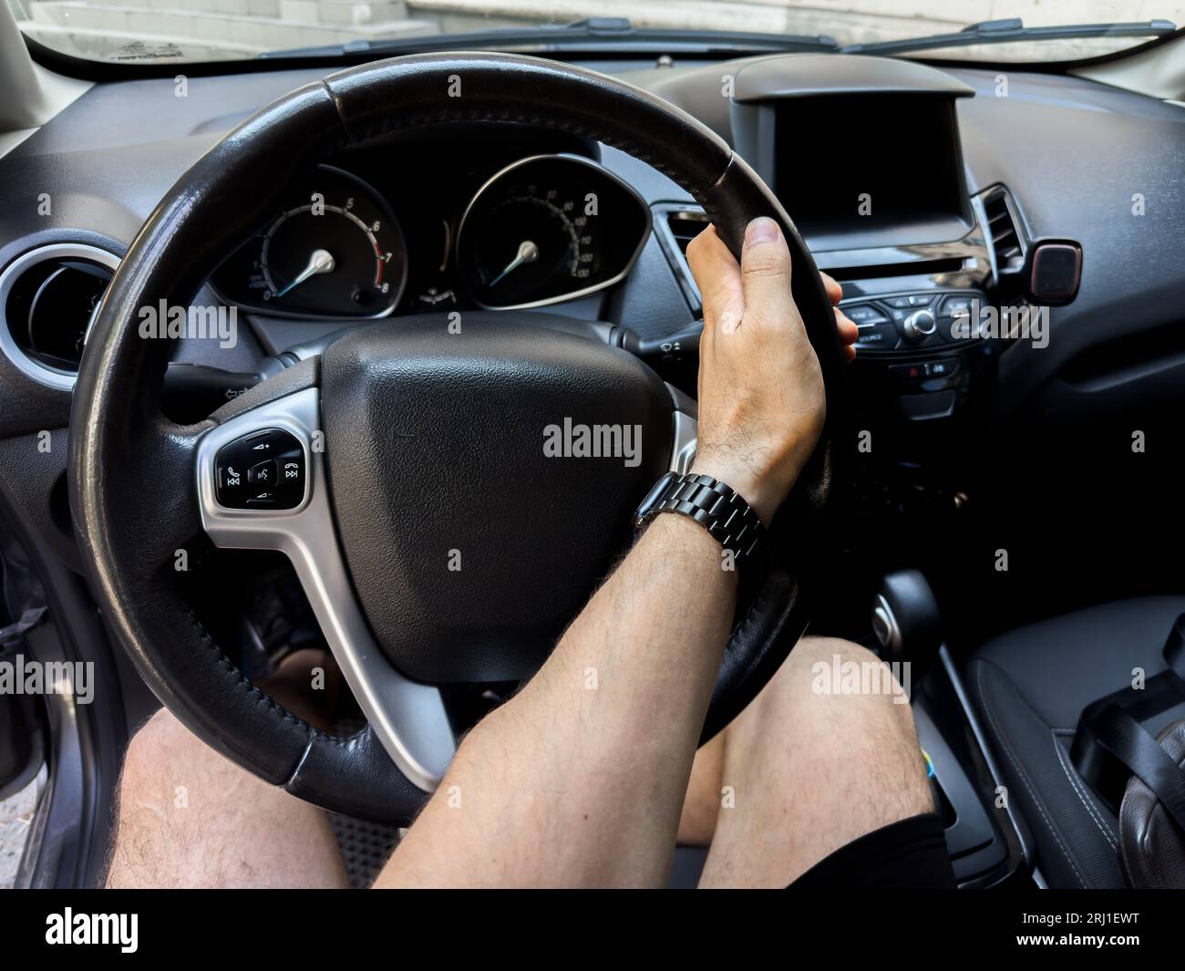 Mans hand steering wheel hi-res stock photography and images - Alamy