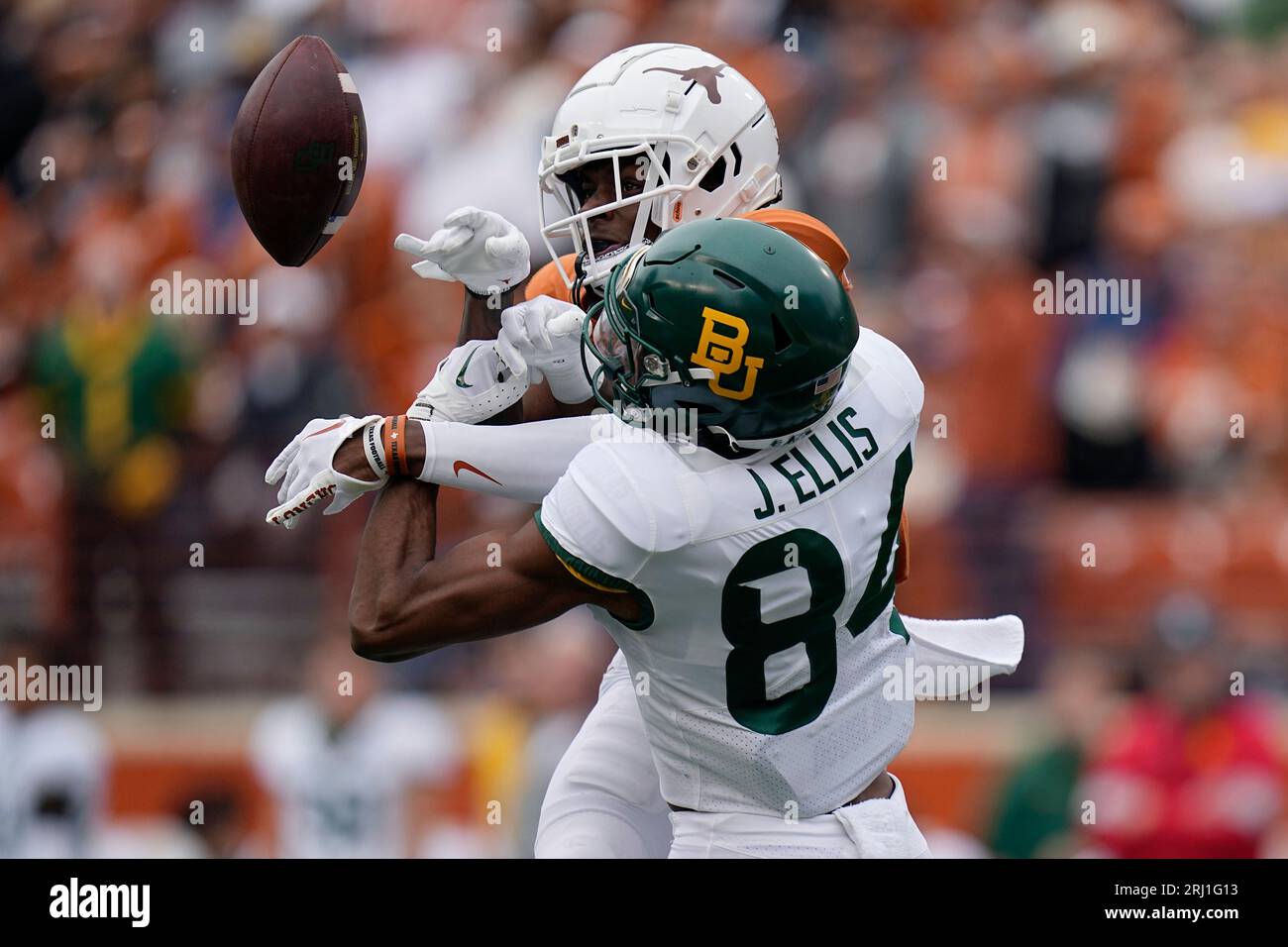 FILE - Texas defensive back Terrance Brooks, left, breaks up a pass ...