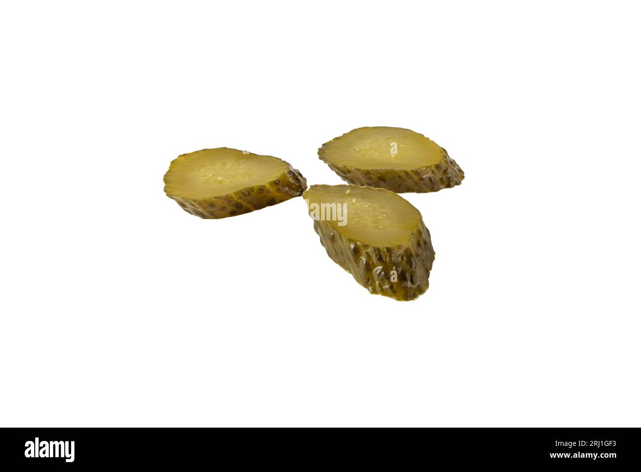 Three pieces of sliced marinated cucumber pickles isolated on white ...