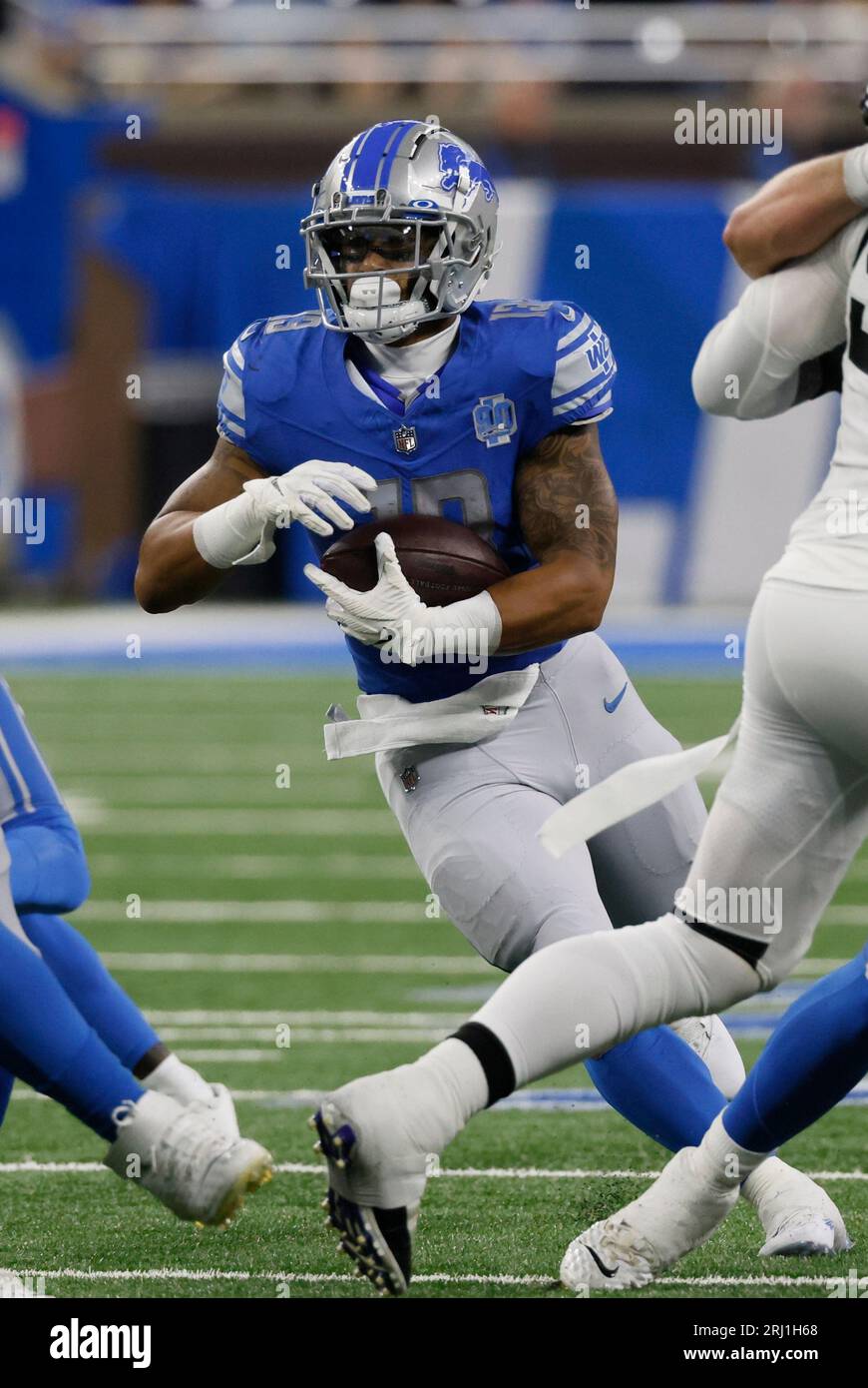 Detroit Lions running back Craig Reynolds (13) carries the ball against ...
