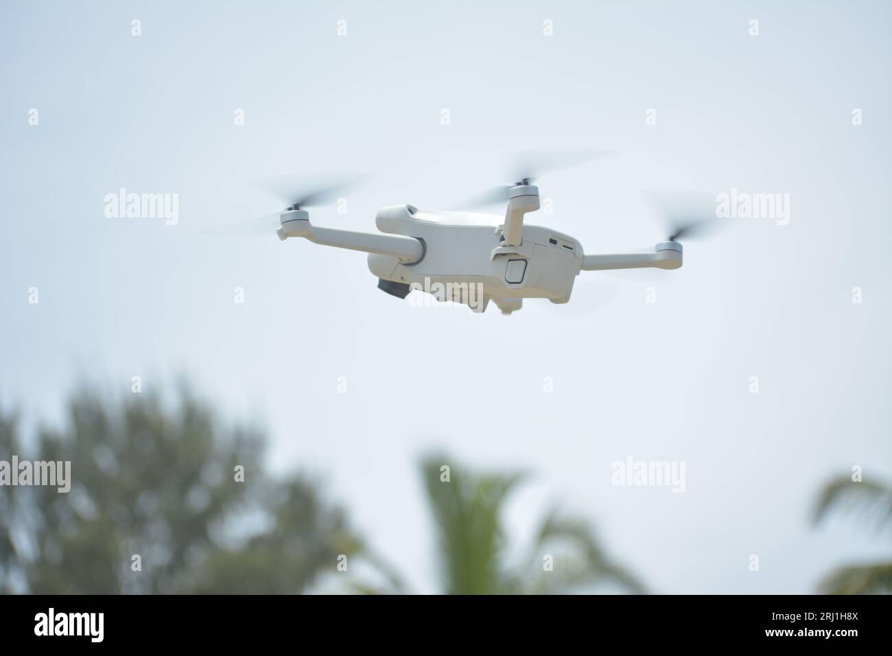 Flying Drone with sky background Stock Photo - Alamy