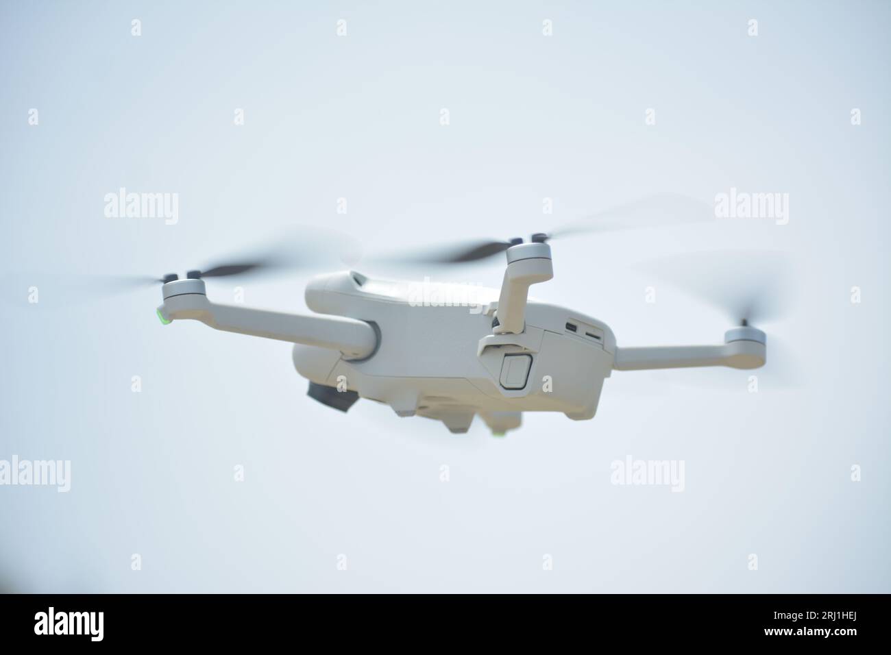 Flying Drone with sky background Stock Photo - Alamy