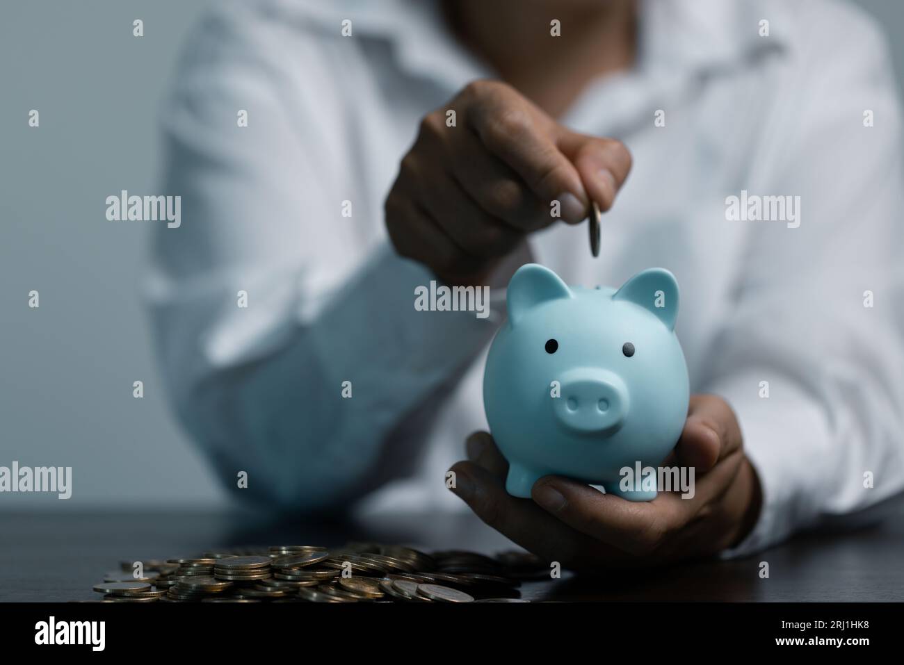 Hand holding money putting glass hi-res stock photography and images ...