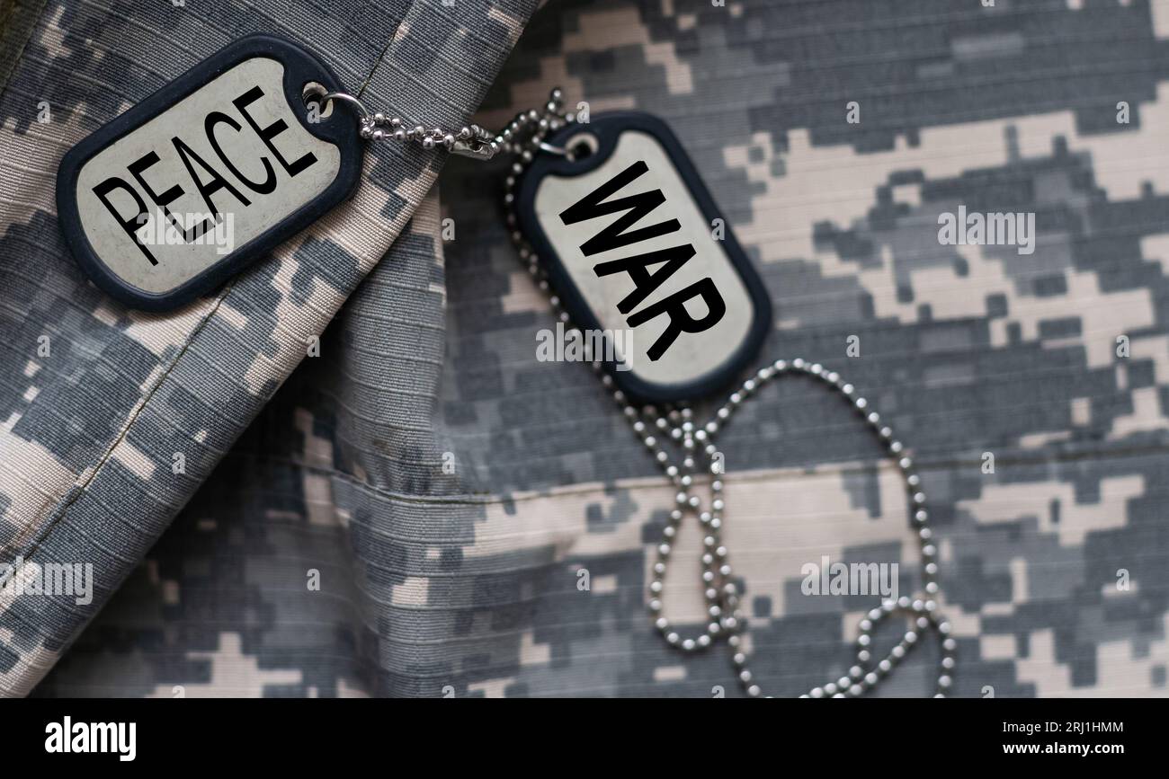 Army tokens on military uniform background Stock Photo - Alamy