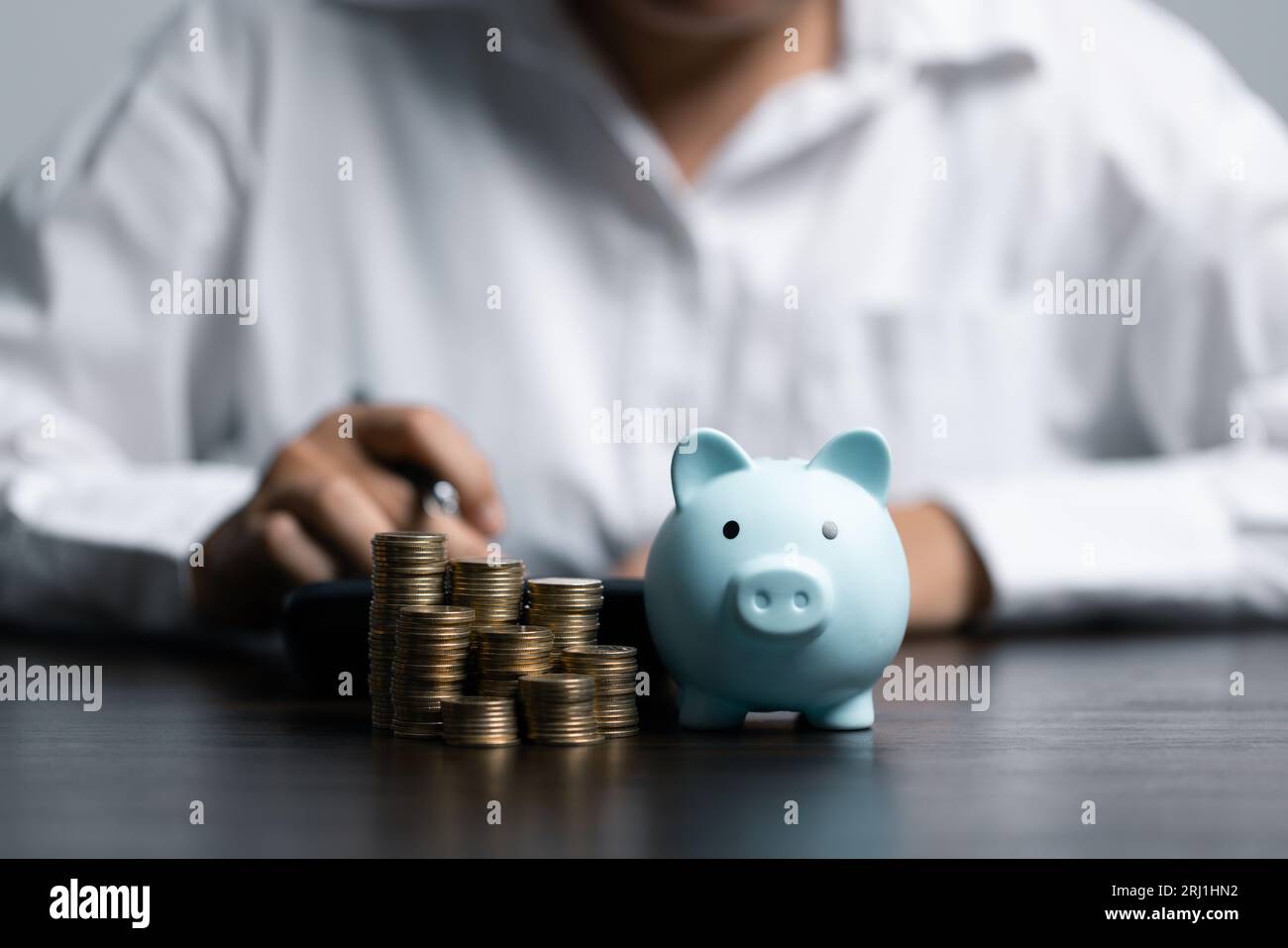 Saving money concept preset by Male hand putting money coin stack ...