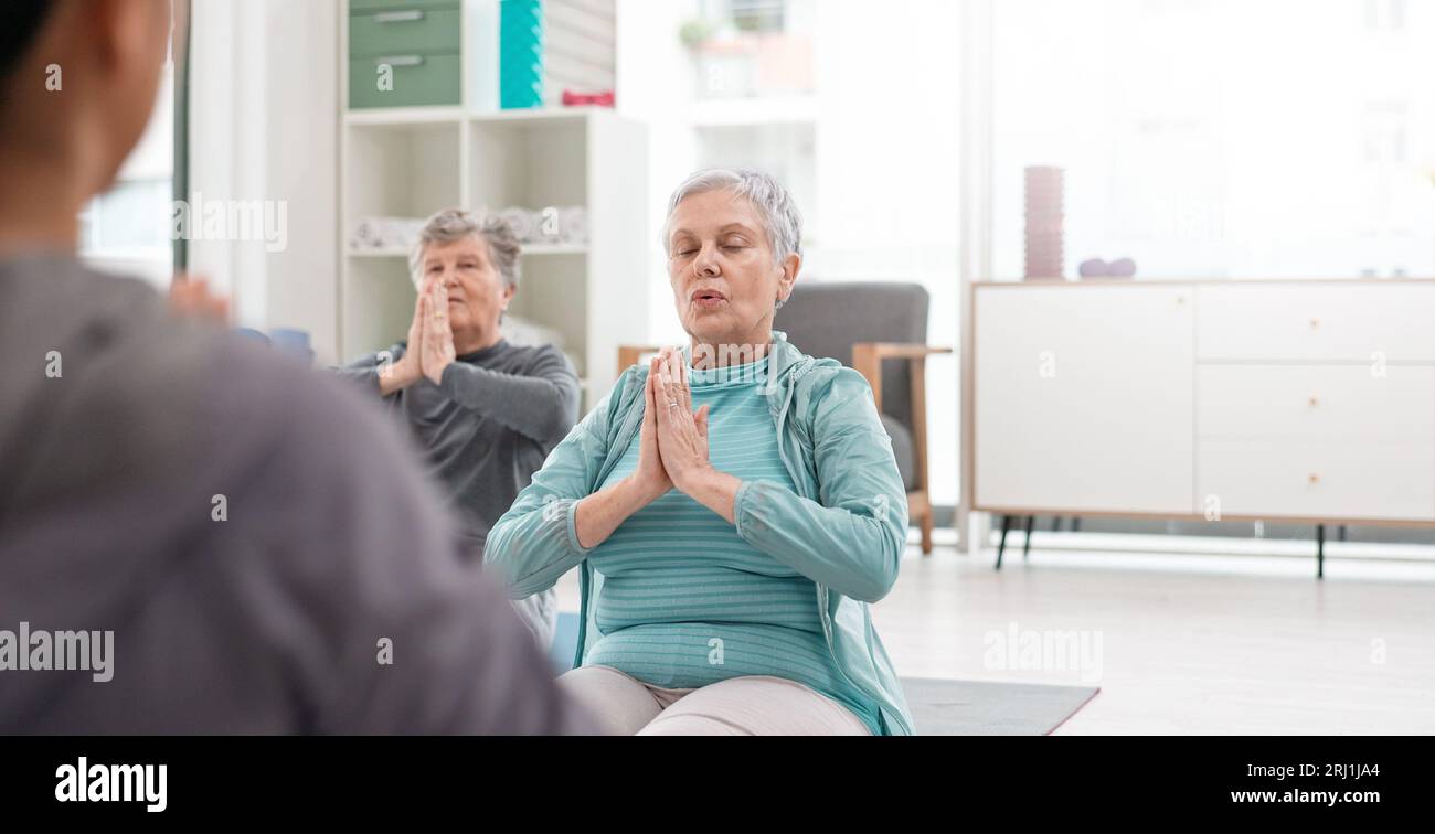 Old people in yoga class, fitness and meditation with breathing ...