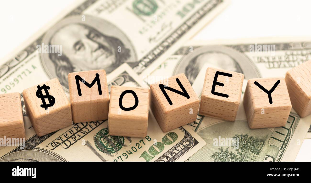 Money Spelled Out in Tiles Stock Photo - Alamy