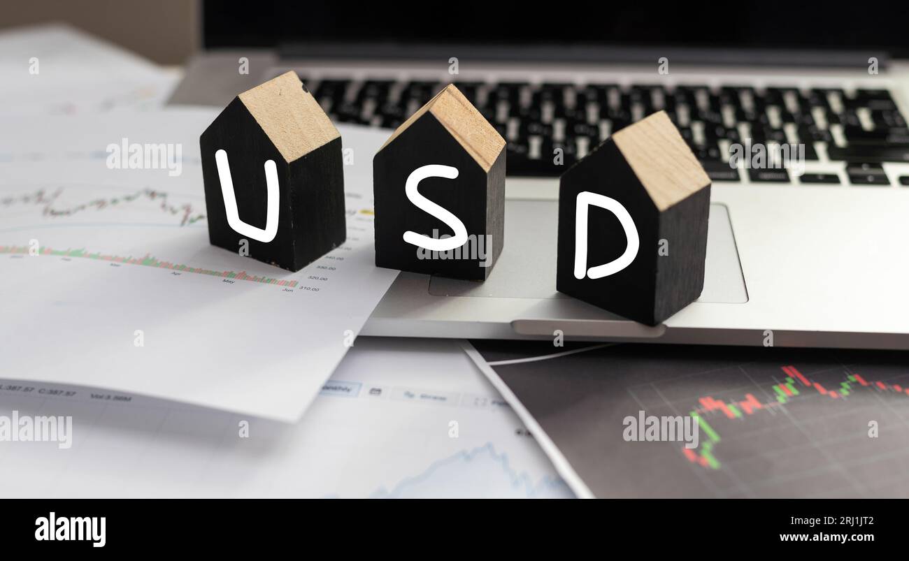 US Dollar alphabetic currency code (USD) and descending red arrow on ...