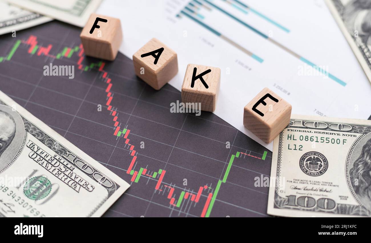 FAKE word written in wooden blocks on computer keyboard Stock Photo - Alamy