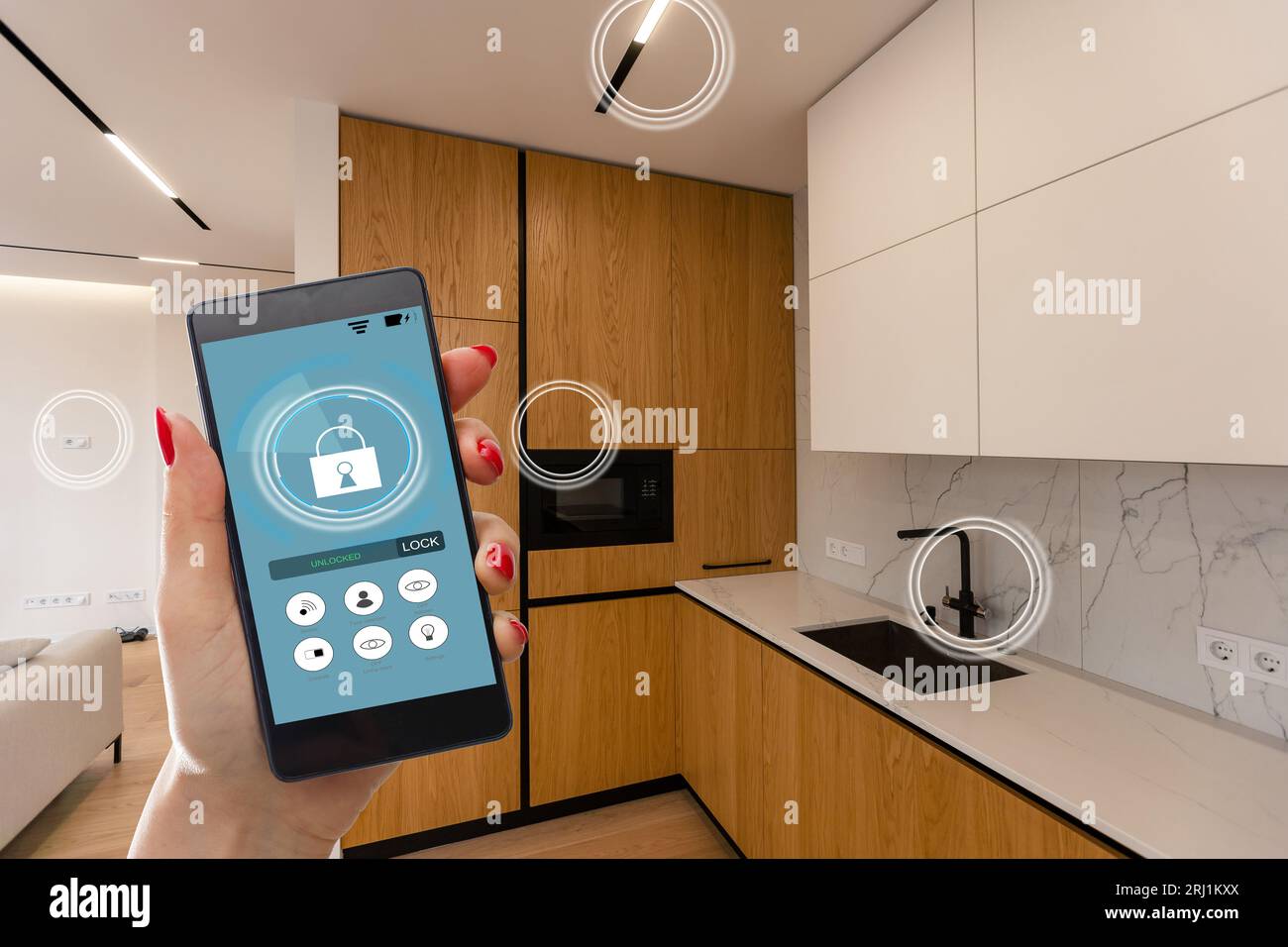 All the house in a phone. Close up of young woman user hands ...