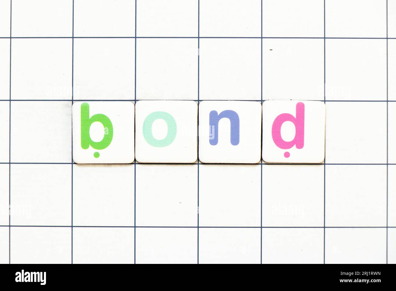 Colorful tile letter in word bond on white grid background Stock Photo ...