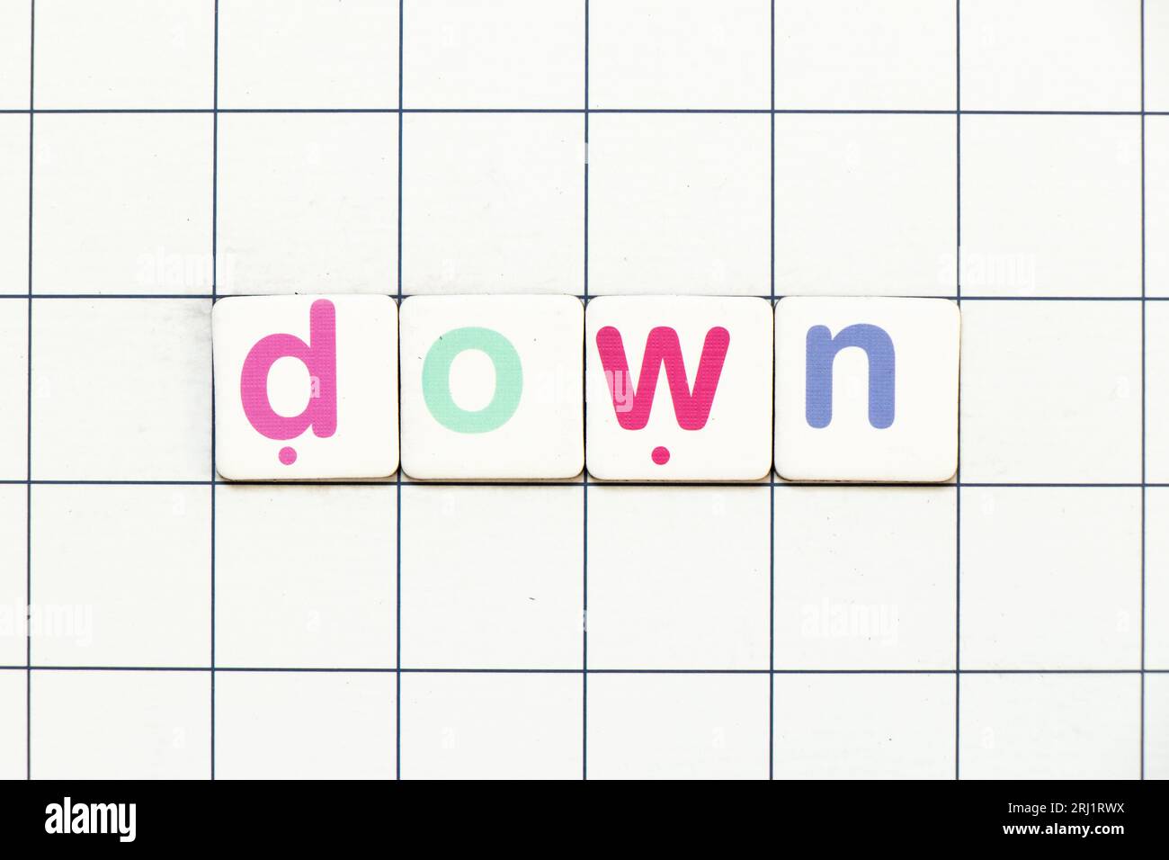 Colorful tile letter in word down on white grid background Stock Photo - Alamy