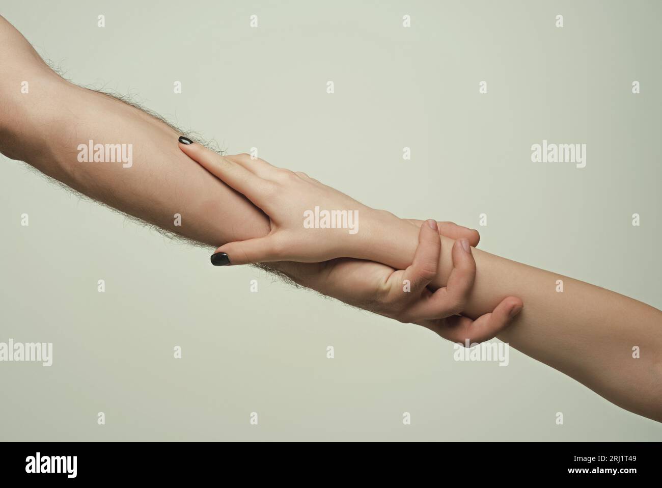 Reaching out to hold hands with each other hi-res stock photography and ...