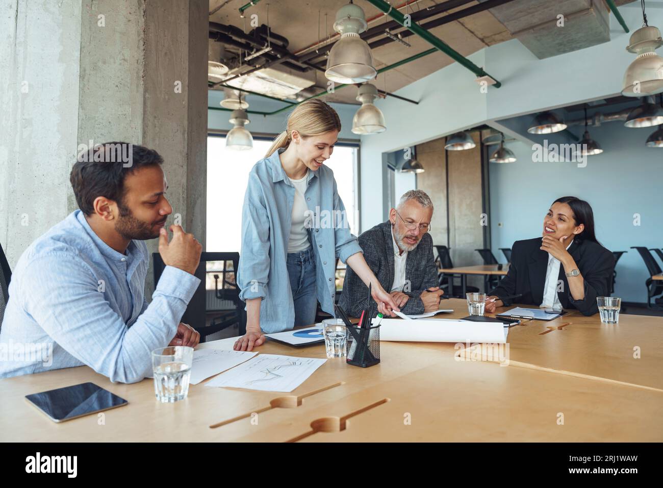 Group of people discussing documents project in the office. Business ...