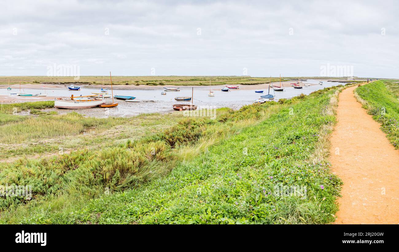 The Norfolk costal path leads out from Burnham Overy Staithe hugging a ...