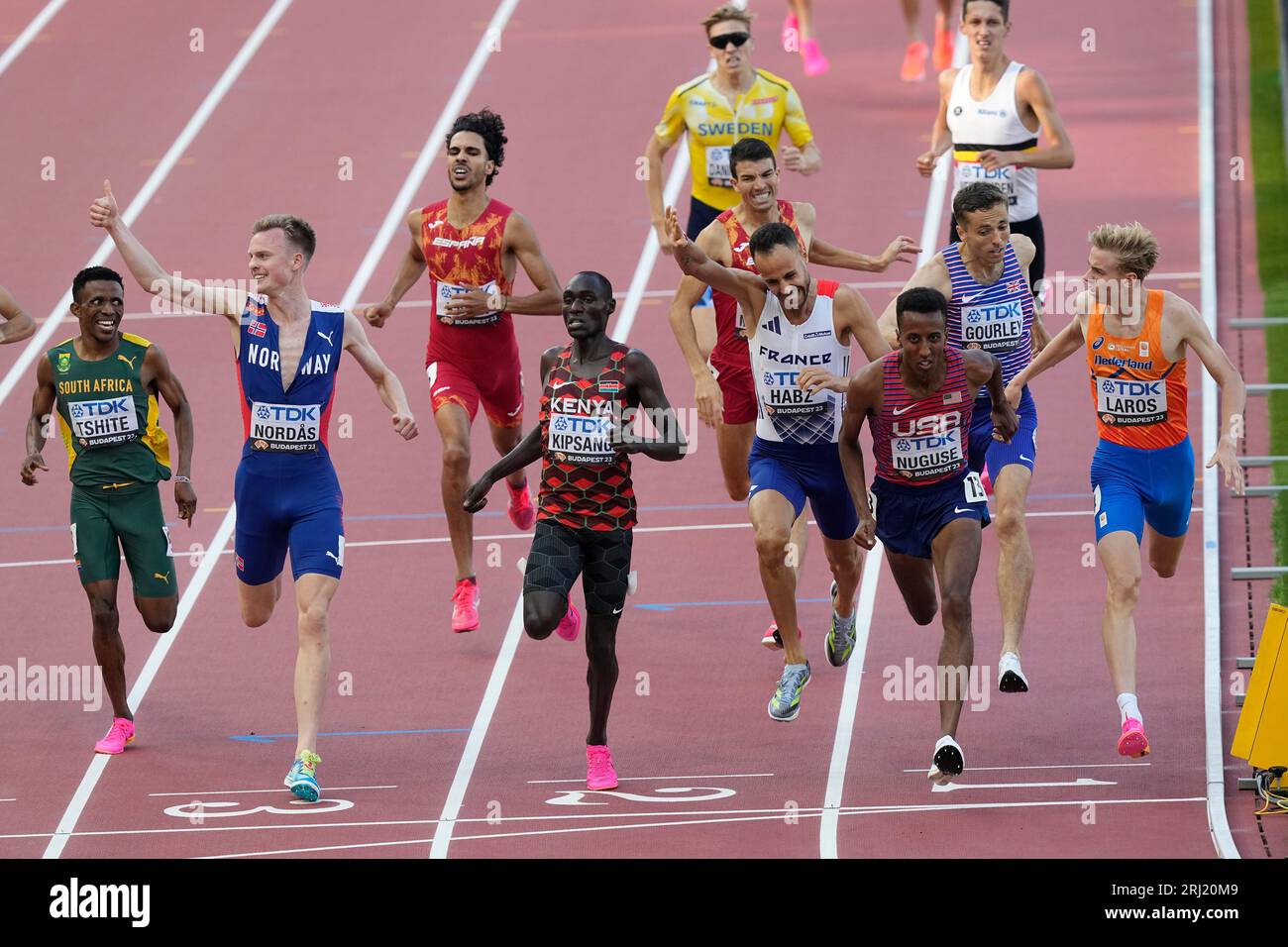 Athletes cross the finish line in a Men's 1500-meter semi-final during ...