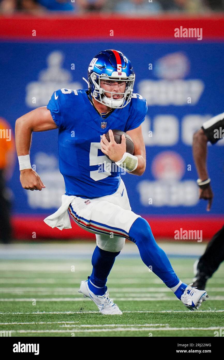 New York Giants quarterback Tommy DeVito (5) runs the bal during an NFL ...
