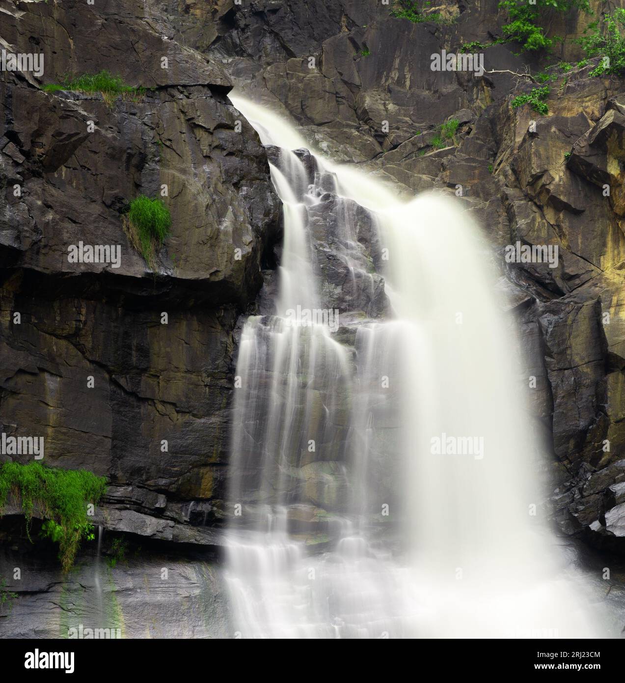 Silky milky smooth waterfall flowing over rocks at Hundru Ranchi ...