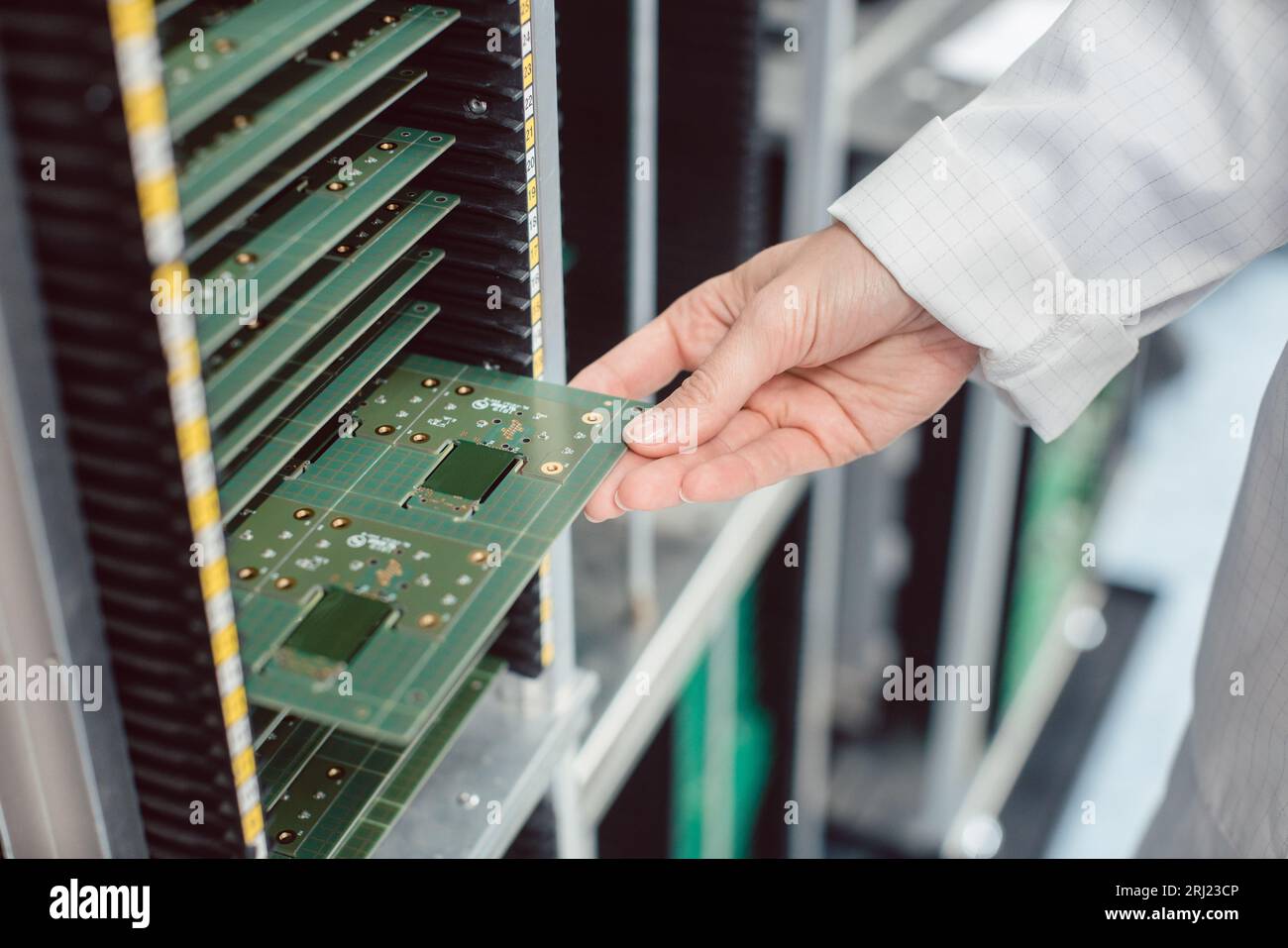 electrical engineer at assembly line inspecting PCB boards Stock Photo ...