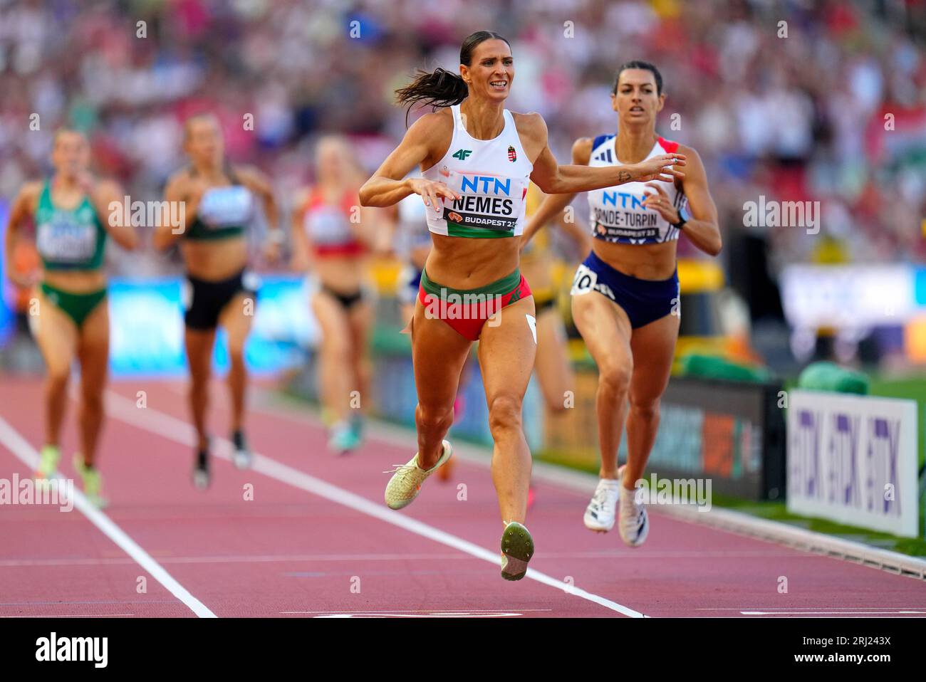 Rita Nemes, of Hungary crosses the line to finish the heptathlon 800 ...