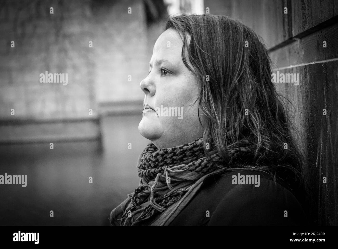 Portrait of a woman standing underneath a bridge Stock Photo - Alamy