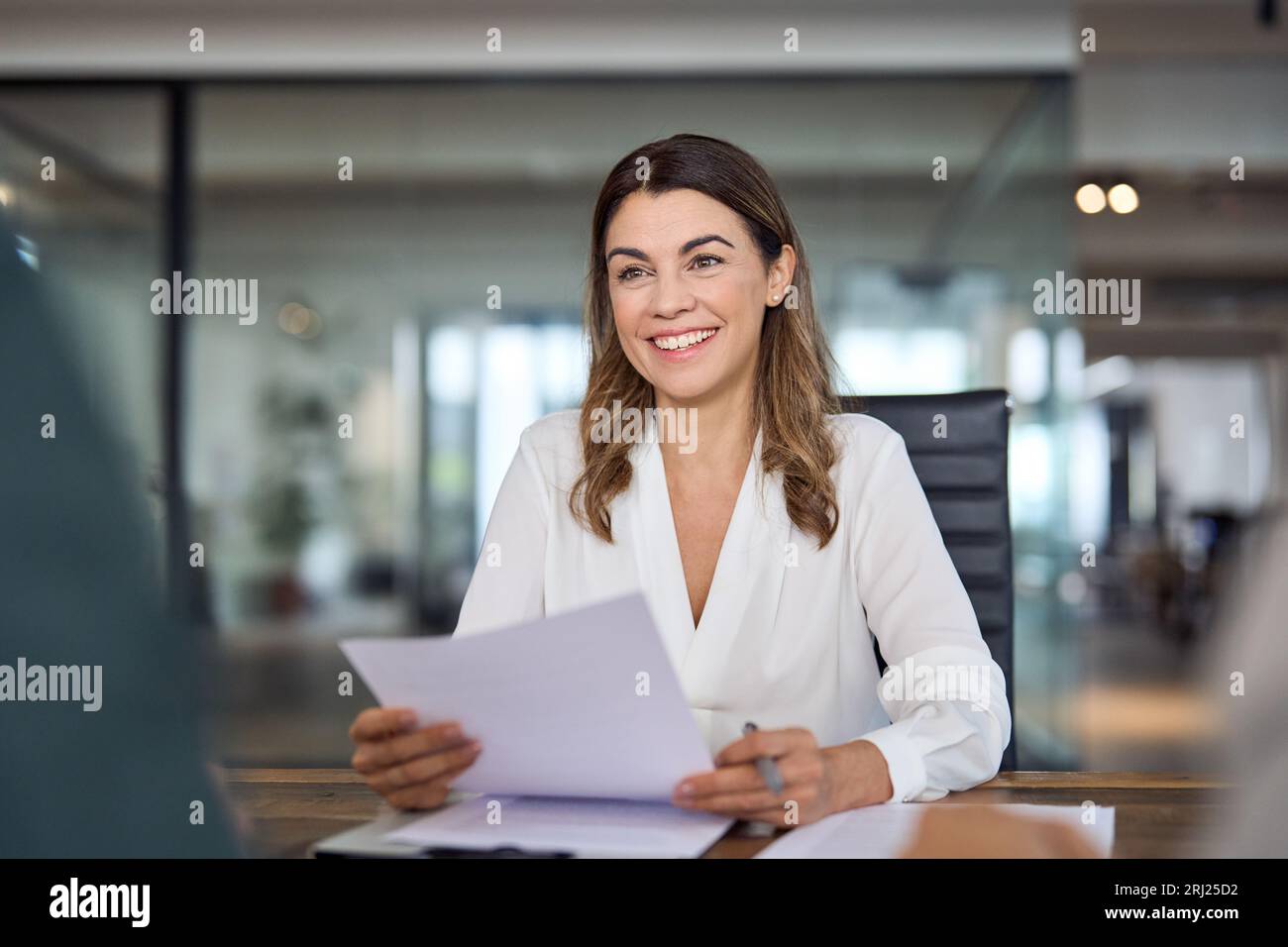 Happy business woman hr manager holding cv at job interview office ...