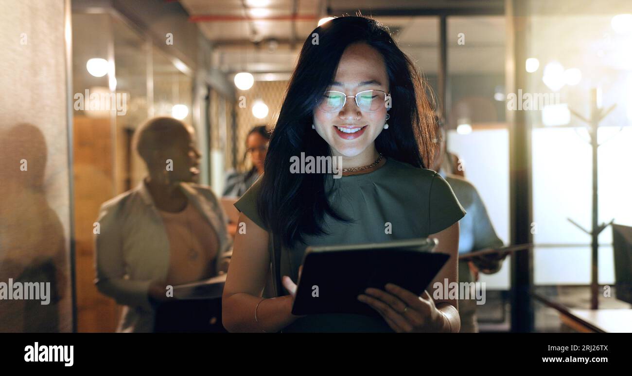 Night, tablet and business people walking in office after finishing ...