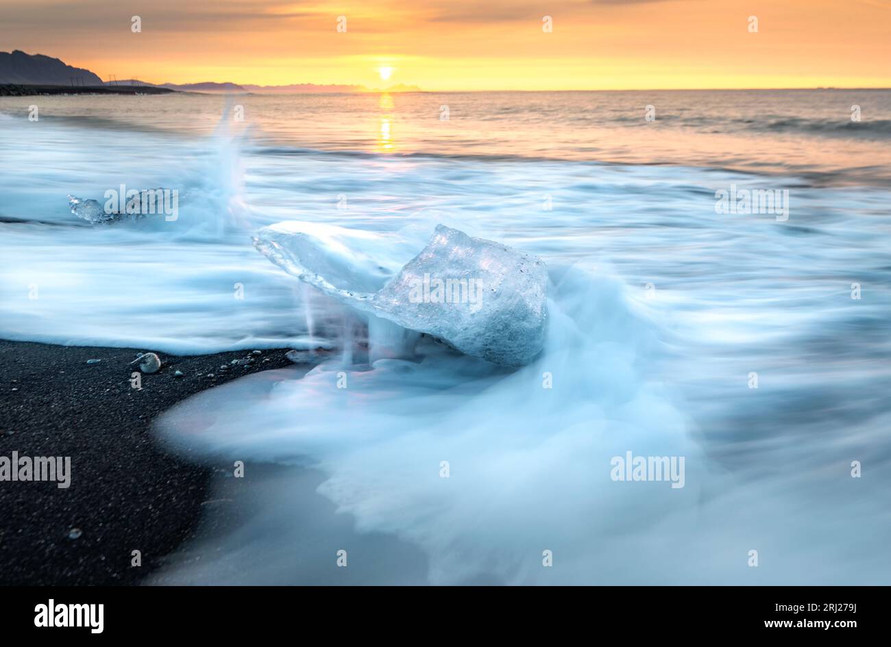 Ice, waves, Sun and beautiful Iceland during sunrise Stock Photo - Alamy