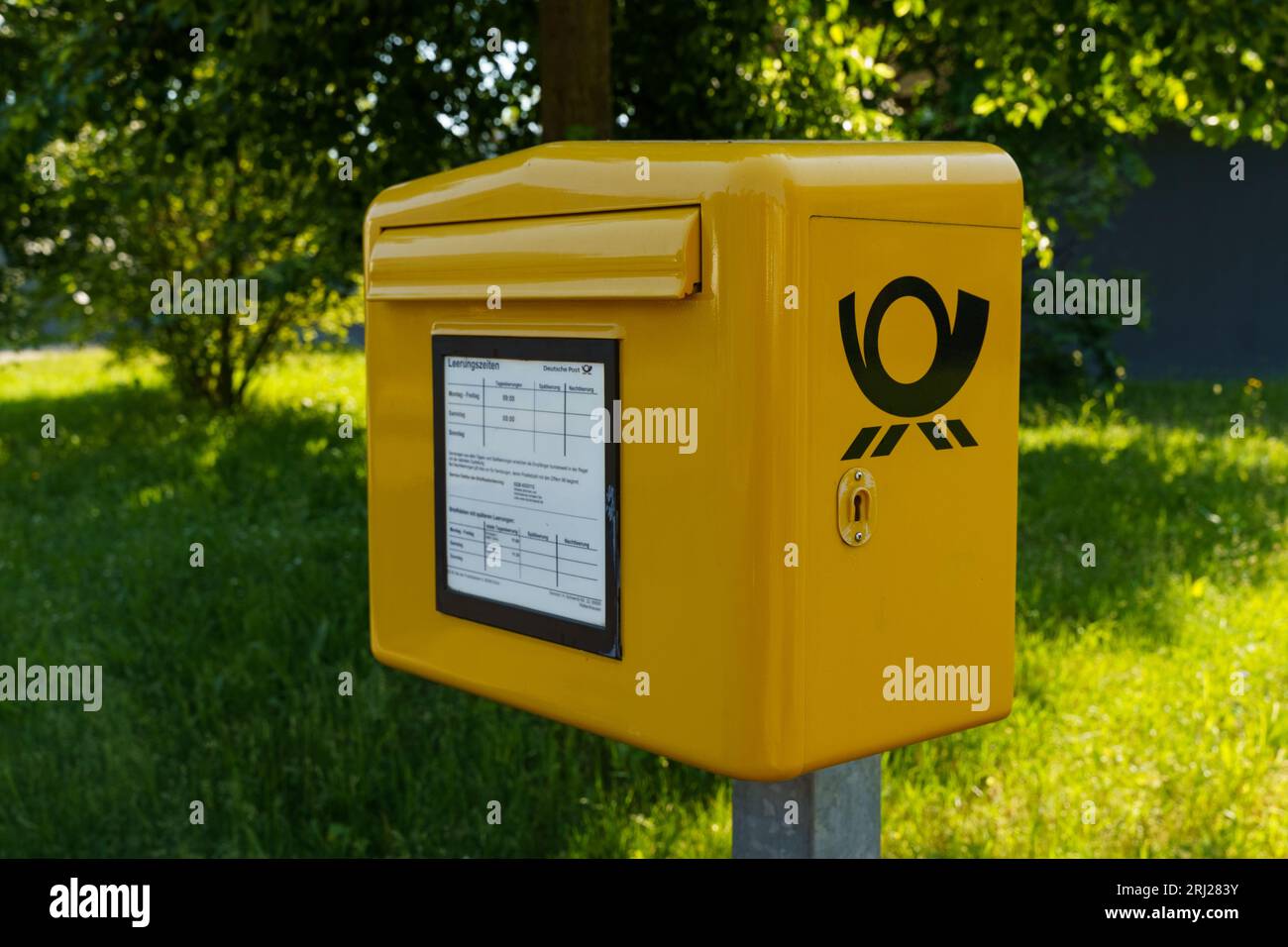 Waltershausen, Germany - June 10, 2023: A yellow German post box ...