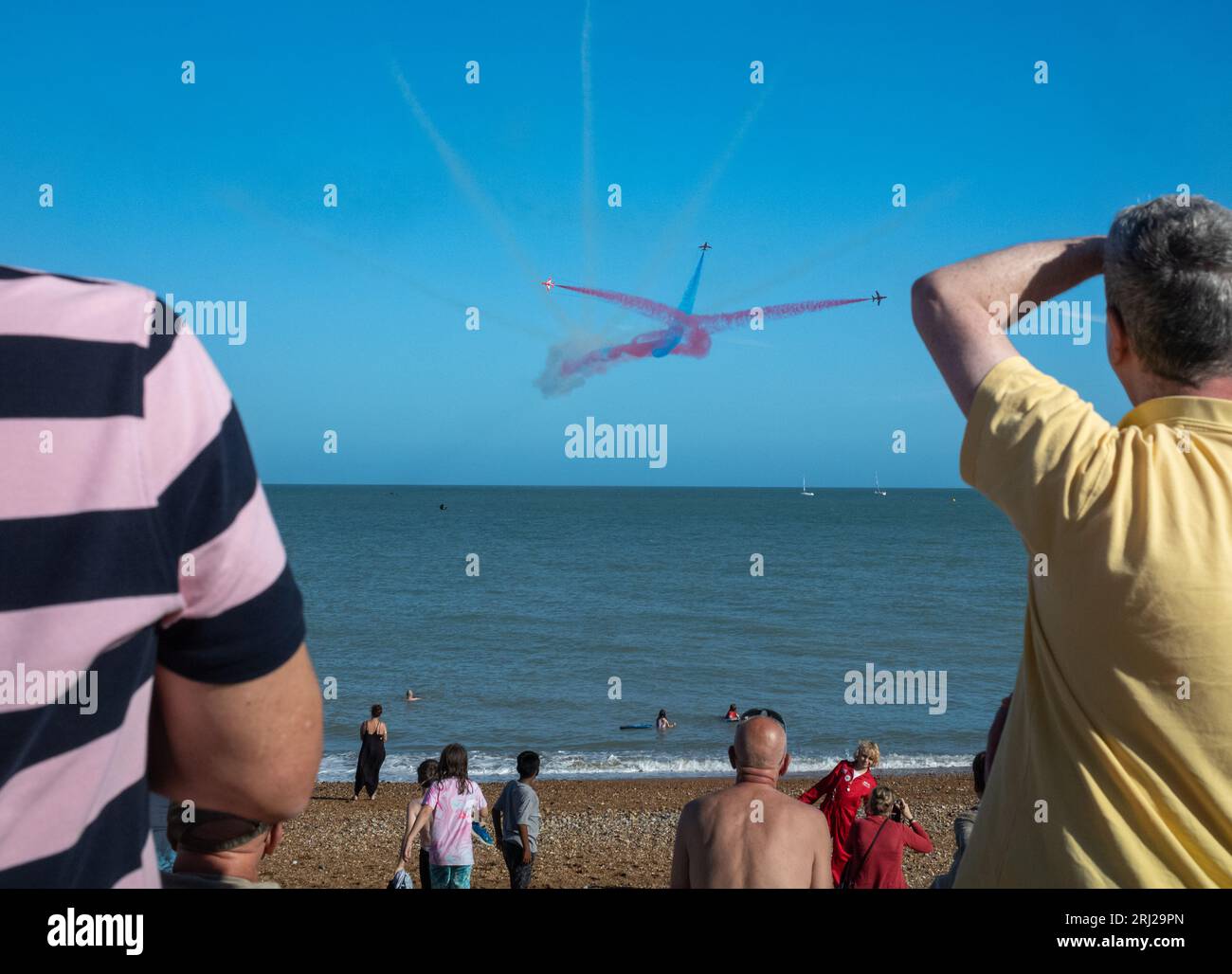 People watch from Eastbourne beach as the world famous RAF display team ...