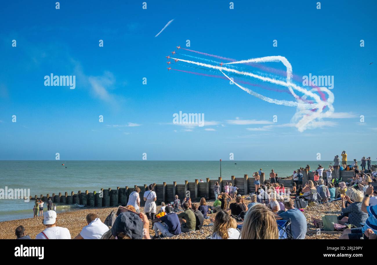 People watch from Eastbourne beach as the world famous RAF display team ...