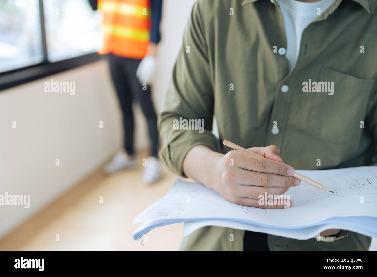 Construction engineer with architect team working check building ...