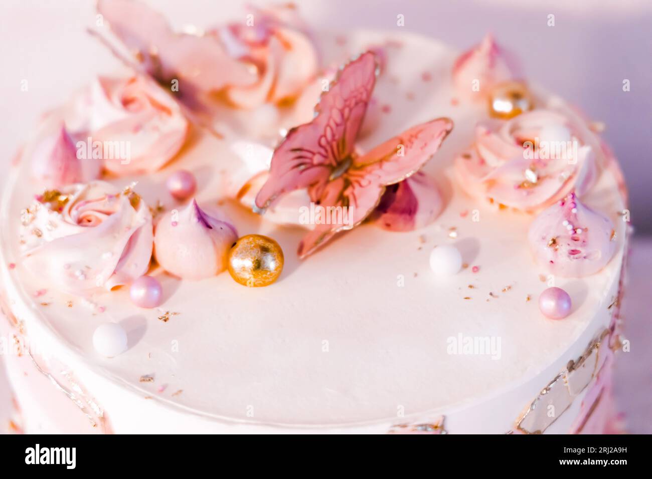 Pink birthday cake flowers butterflies hi-res stock photography and ...