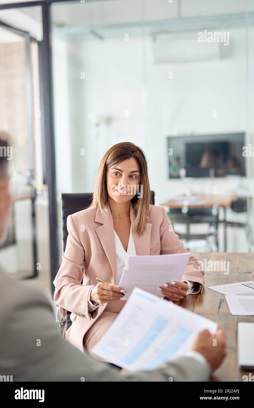 Mature business woman manager holding documents at office meeting Stock ...