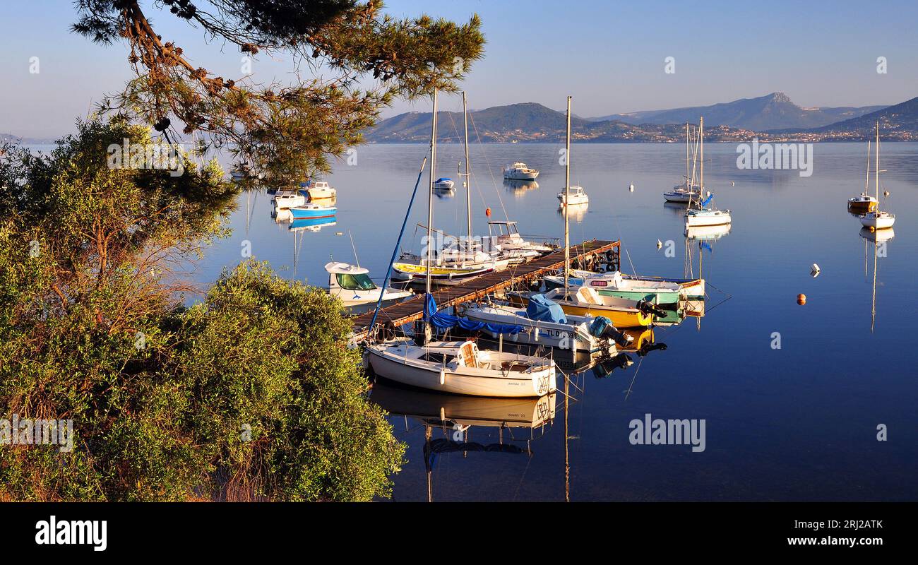 Small boats moored at the little port of La Madrague on the Giens ...