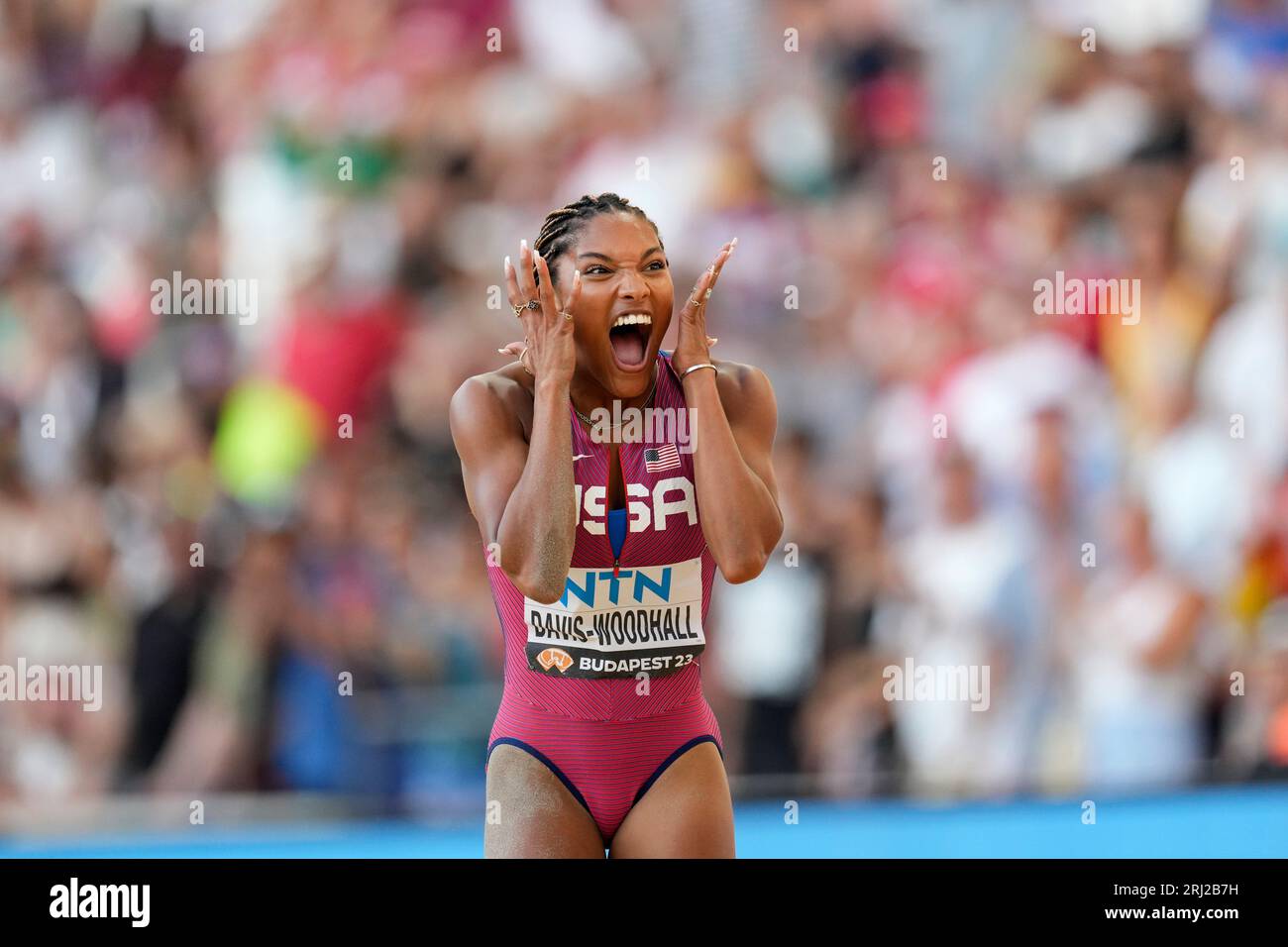 Tara Davis-Woodhall, of the United States, reacts after winning the ...