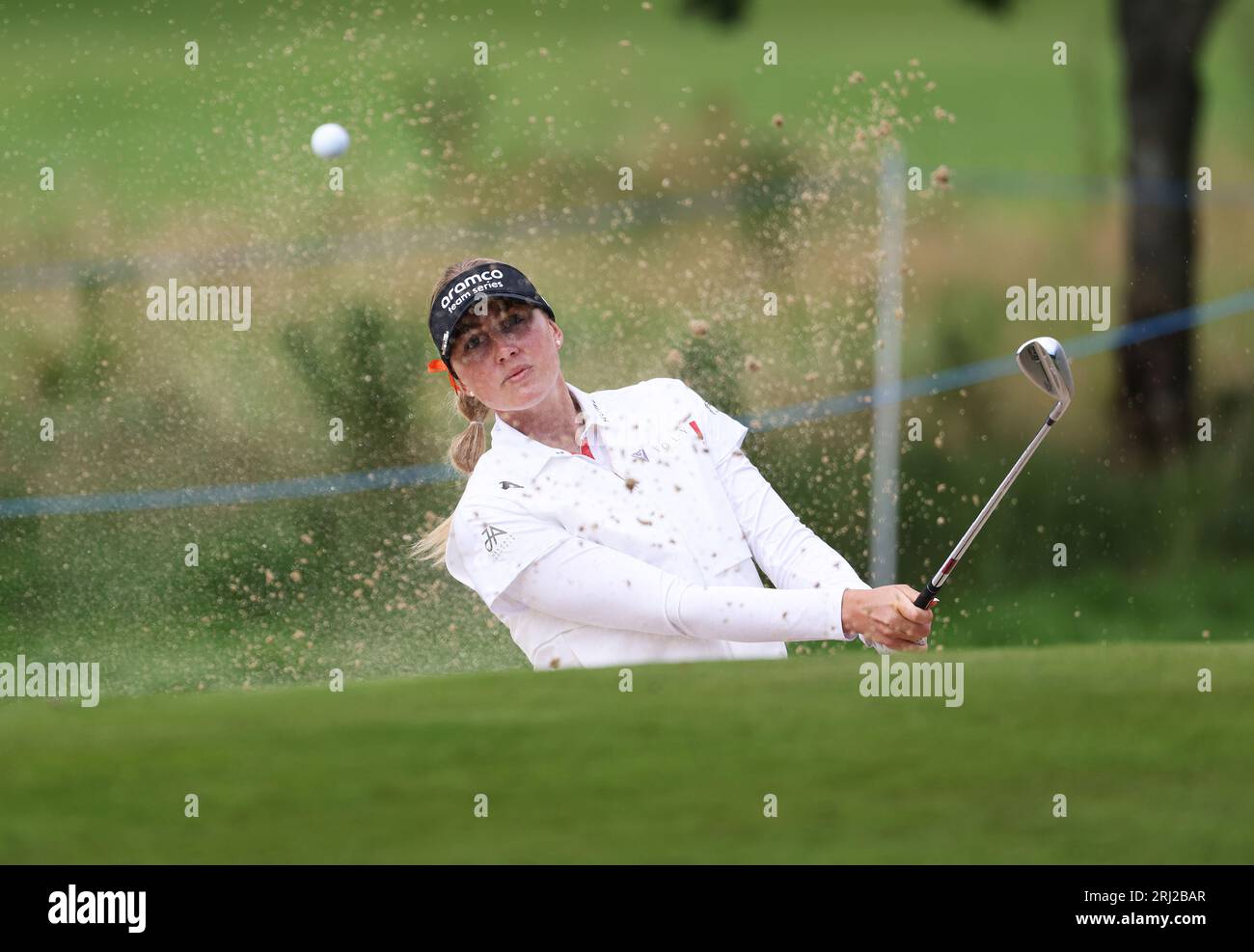 Olivia Cowan plays out of the bunker on the 17th hole during day four ...