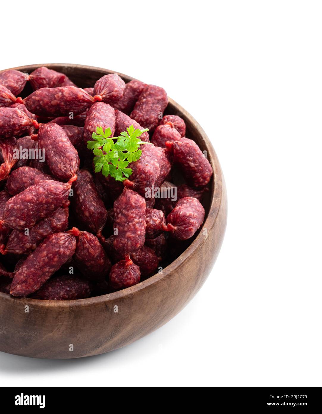Mini salami sausages in wooden bowl isolated on white Stock Photo - Alamy