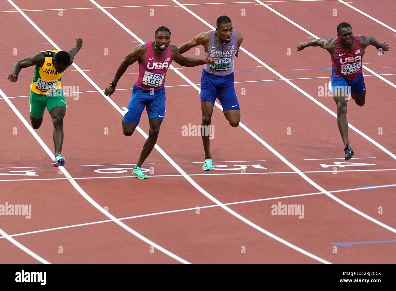 Noah Lyles, of the United States, crosses the finish line first in lane ...